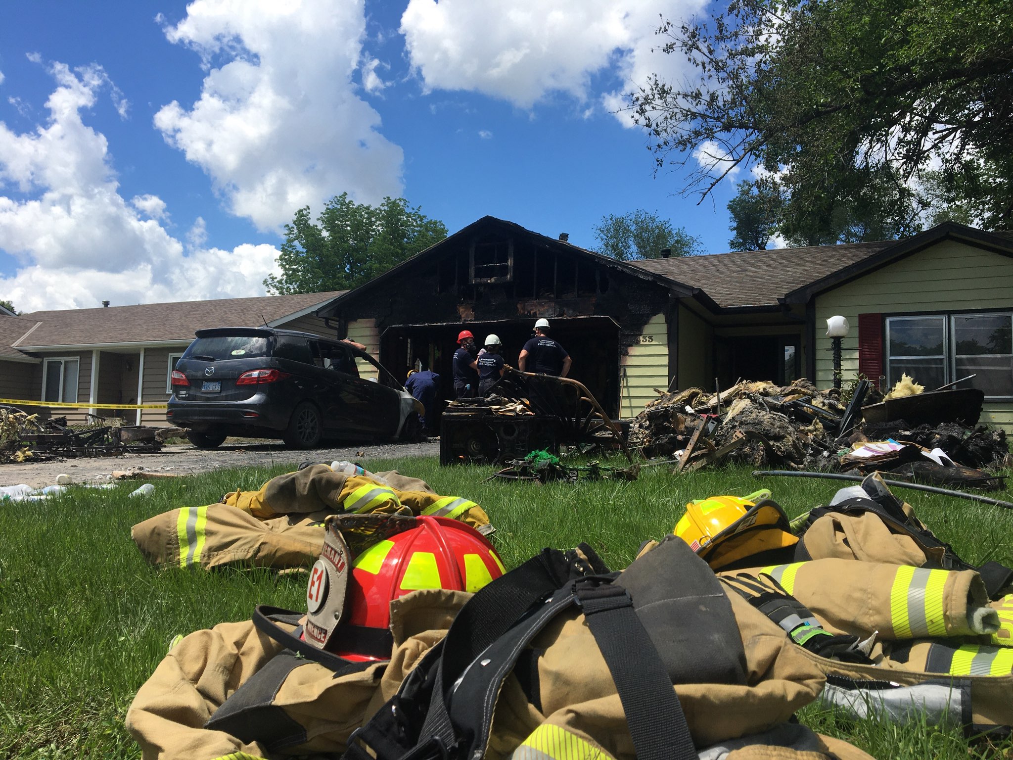 Early morning fire engulfs Lawrence house’s garage; family dog dies in ...